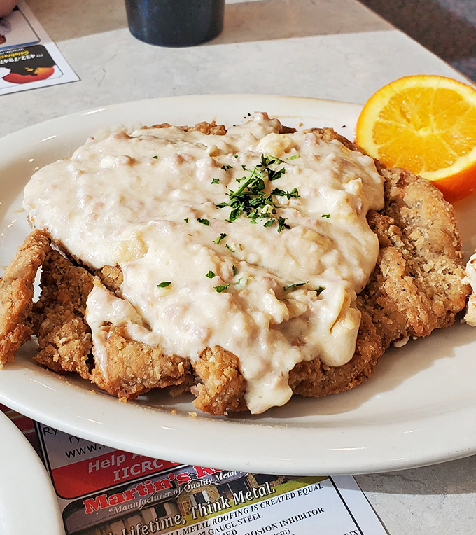 Country fried steak smothered in creamy gravy&mdash;the kind of dish that makes you want to hug the chef. Comfort food that means business.