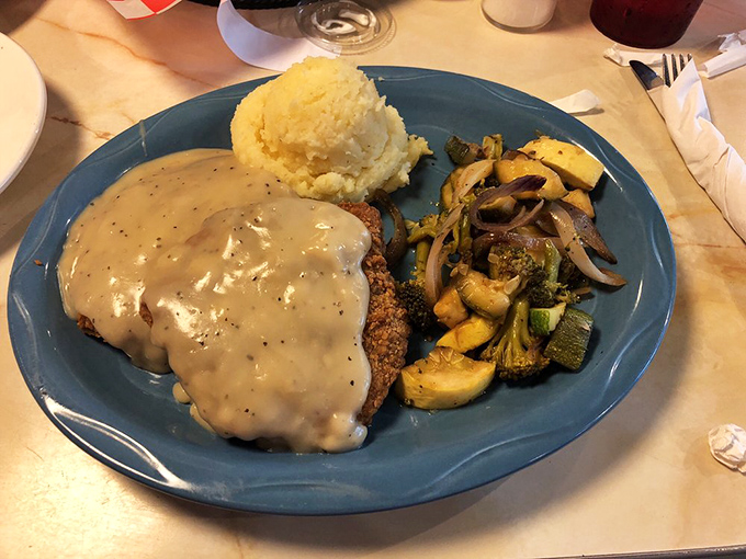 Country fried steak smothered in gravy with a mountain of mashed potatoes: comfort food's greatest hits album.