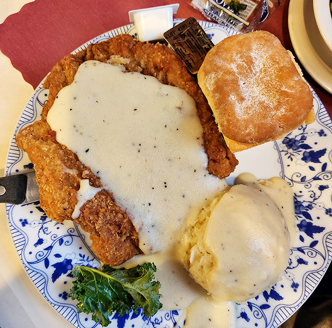Country fried steak smothered in gravy that could solve international conflicts. Add a homemade biscuit, and you've got the ultimate Midwest peace treaty.