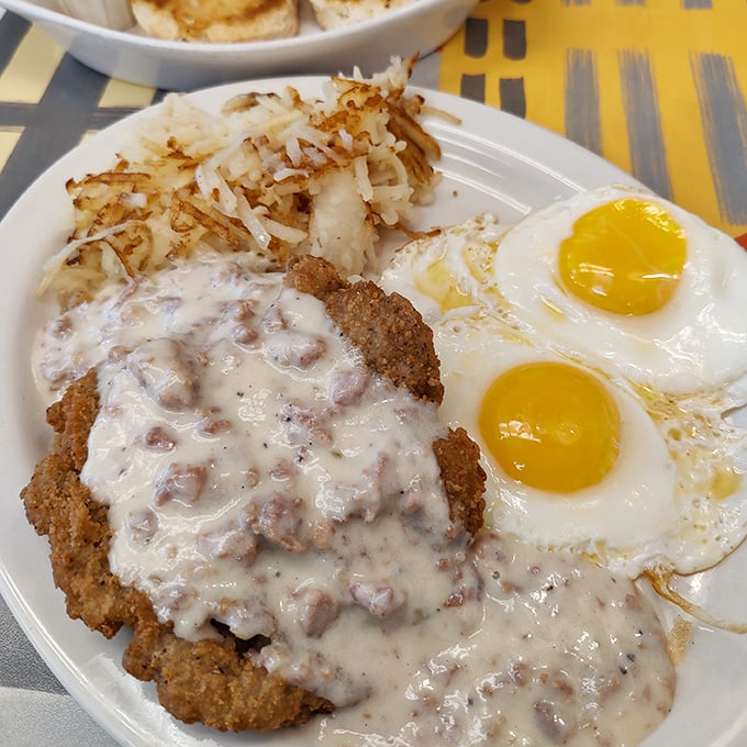 Country fried steak that's had a proper upbringing&mdash;crispy exterior, tender inside, and smothered in gravy that would make your grandmother nod in approval.