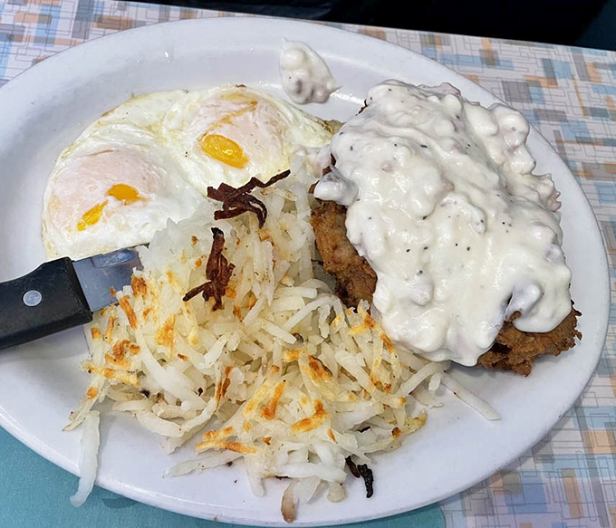 Country fried steak smothered in gravy with eggs sunny-side up&mdash;the breakfast equivalent of winning the lottery before noon.