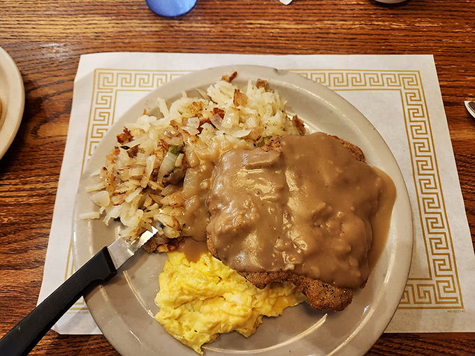 Country fried steak smothered in gravy&mdash;because some mornings require more than just coffee to face the day ahead.