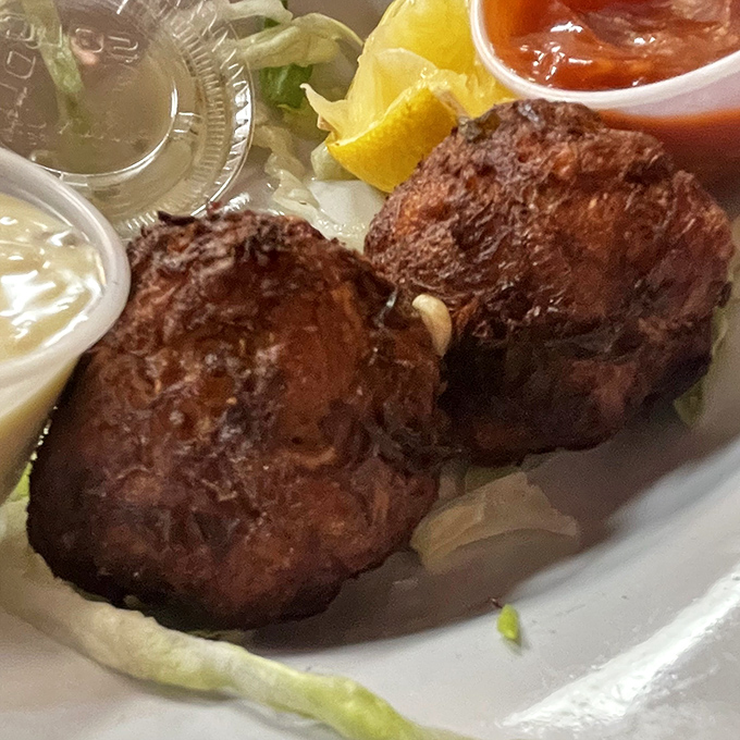 These golden-brown crab balls aren't just appetizers, they're edible souvenirs of Delaware's seafood heritage. Crispy outside, succulent inside.
