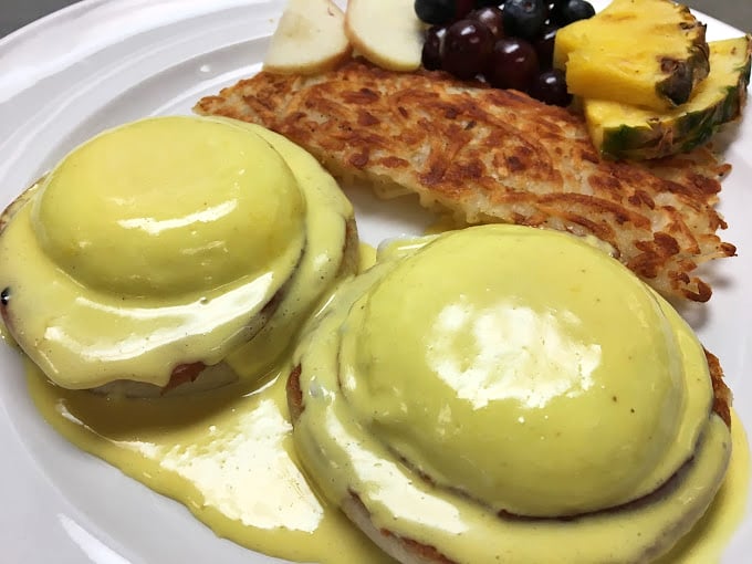 Eggs Benedict gets the royal treatment with a hollandaise so yellow it could brighten even the gloomiest Monday morning.