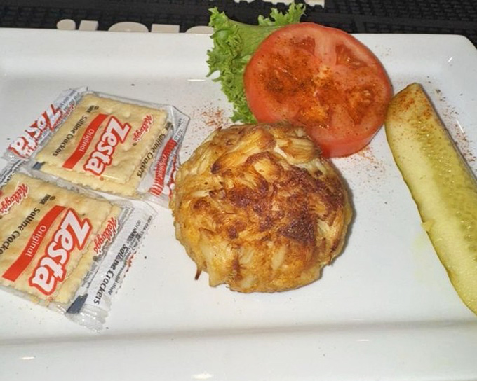 Simplicity at its finest: a softball-sized crab cake, crackers, and fresh vegetables. When the star is this talented, you don't need a supporting cast.