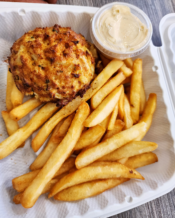 The platonic ideal of a Maryland crab cake&mdash;golden-brown exterior, minimal filler, and served with fries that are clearly not an afterthought.