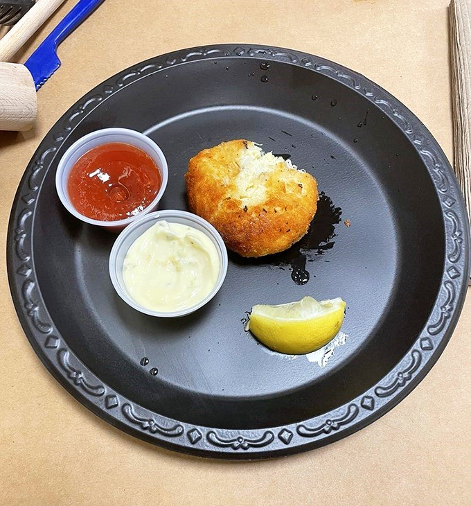 The Maryland crab cake in its natural habitat&mdash;minimal filler, maximum flavor. That golden crust gives way to sweet lump meat that tastes like the Chesapeake itself.