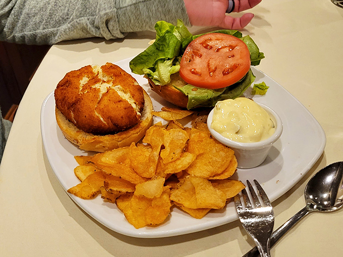 A crab cake sandwich that actually tastes like crab (revolutionary concept!) with house-made chips that make store-bought versions weep with inadequacy.