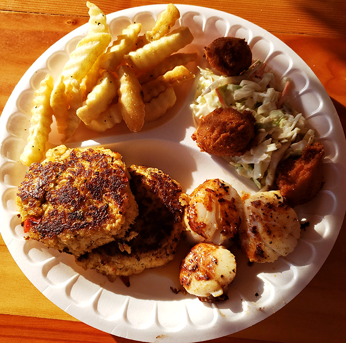 A seafood platter that hits all the right notes – crab cakes, scallops, and hushpuppies performing in perfect harmony on this coastal symphony plate.