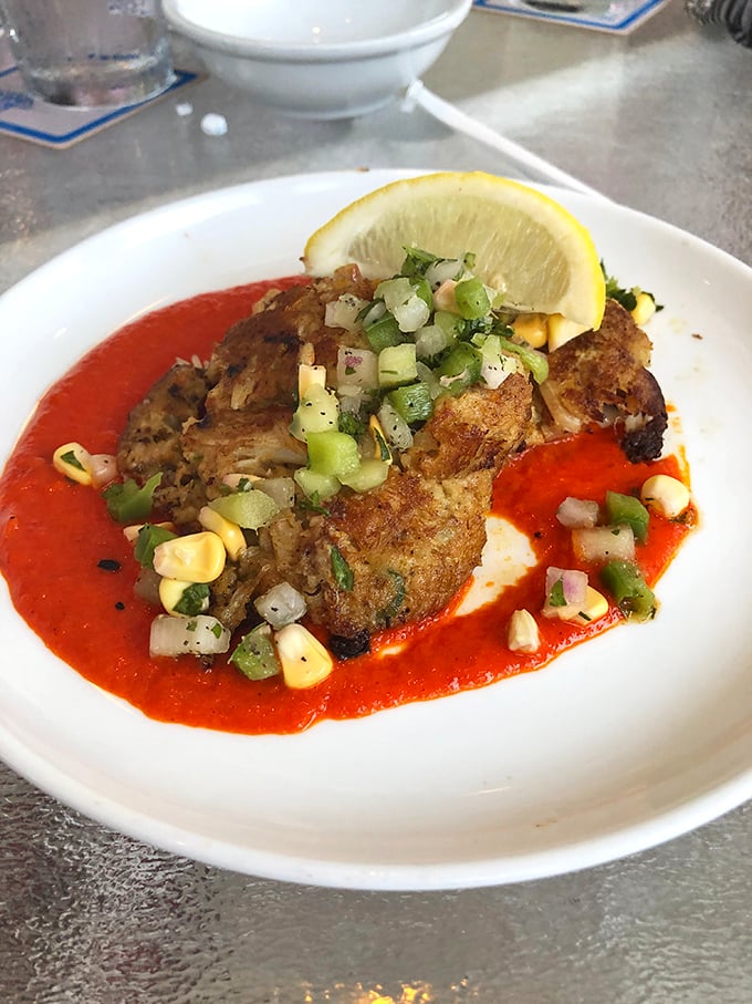 This crabcake doesn't hide behind fillers&mdash;it struts on a runway of vibrant sauce with corn confetti celebrating its arrival.