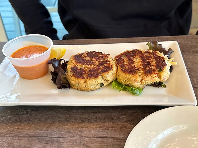 These golden crab cakes aren't just appetizers, they're an event&mdash;crispy exterior giving way to seasoned crab meat that tastes like the ocean's finest offering.