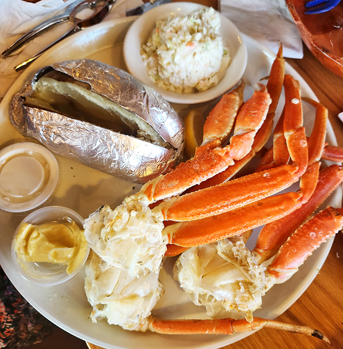Crab legs so impressive they deserve their own zip code. That baked potato in foil is just trying to keep up with the star of the show.