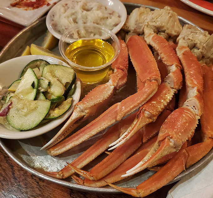 Snow crab legs arranged like nature's perfect finger food – the ocean's version of "assembly required" that's actually worth the effort.
