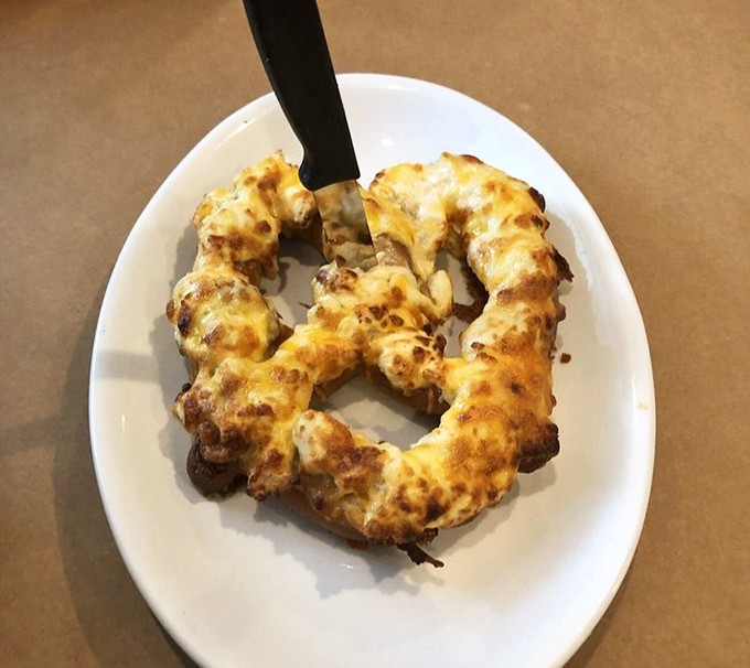 The crab pretzel at Waterman's&mdash;where comfort food meets luxury. It's like someone said, "What if we made a pretzel that could change your life?"