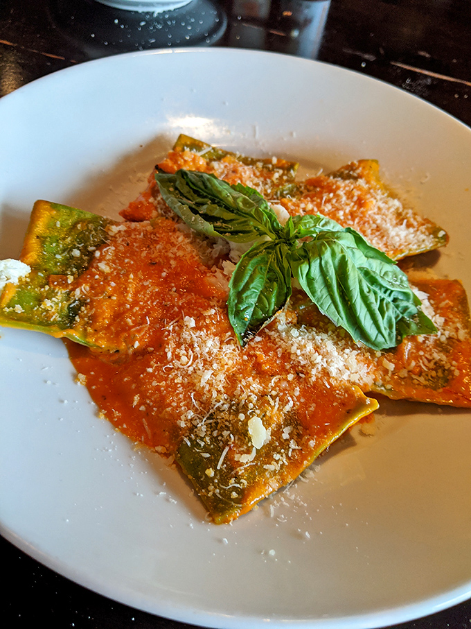 Ravioli that looks like it's blushing with pride, these pasta pillows swim in a tomato sauce bright enough to require sunglasses.