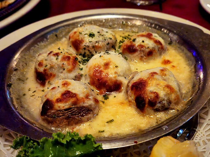 Crab-stuffed mushrooms swimming in butter, because Wisconsin believes cheese isn't the only food group worth celebrating.