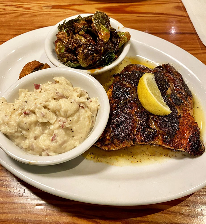 Blackened fish meets creamy grits and roasted Brussels sprouts &ndash; a plate that proves Southern cooking isn't just comfort food, it's sophisticated comfort food.