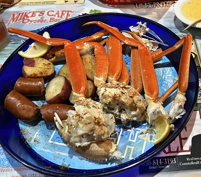 Snow crab legs arranged like nature's perfect finger food—a glorious excuse to roll up your sleeves and get deliciously messy.