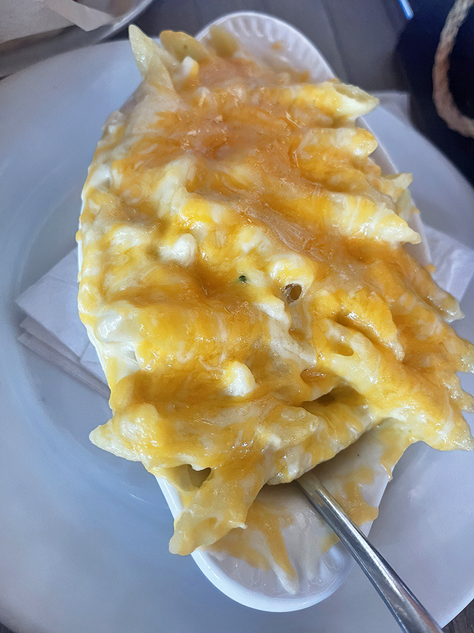 The Crabbie Mac isn't just comfort food &ndash; it's a warm, cheese-blanketed hug that somehow captures the essence of the Chesapeake in every forkful.