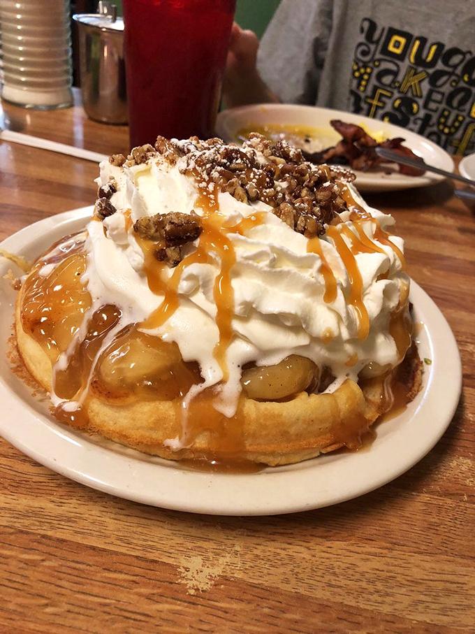 This isn't just a waffle&mdash;it's an edible pedestal showcasing caramel, whipped cream, and nuts in perfect harmony.