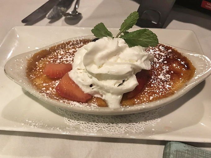 Cr&egrave;me br&ucirc;l&eacute;e with fresh strawberries and whipped cream&mdash;because you drove all this way, and dessert is basically mandatory at this point.