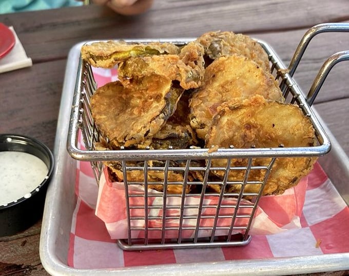 Crispy pickles: where tangy meets crunchy in a basket of golden-fried perfection. The dipping sauce is just a bonus round.