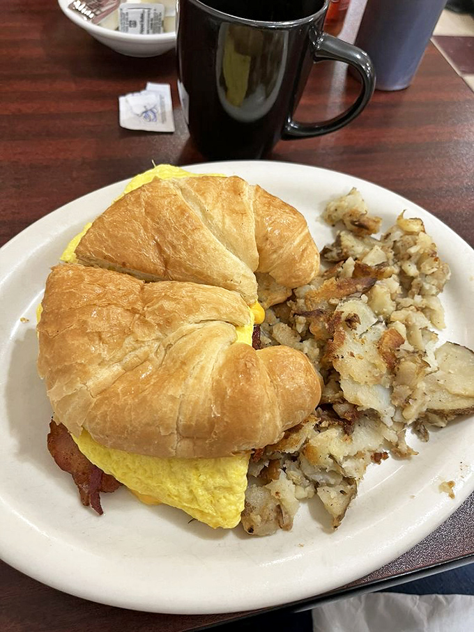 The breakfast sandwich that answers the eternal question: "Why choose between a croissant and eggs when you can have both?"
