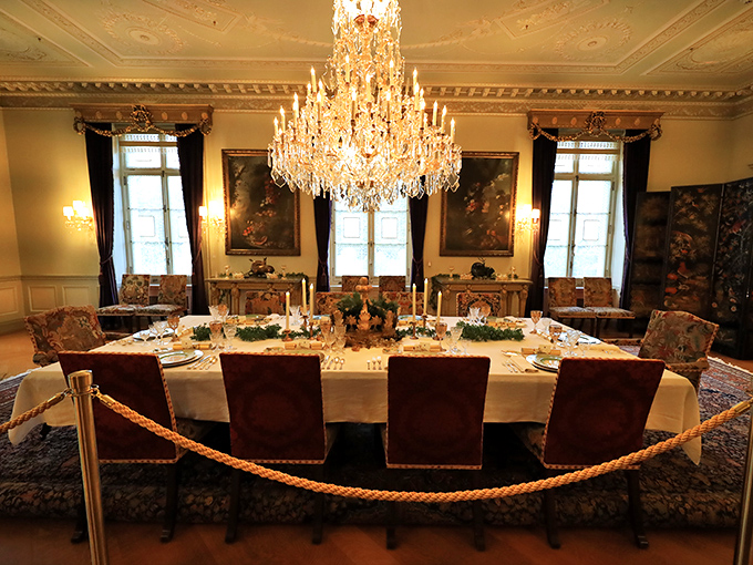 A dining room where even the chandelier is overdressed for dinner. Those chairs have witnessed conversations that changed American industry.