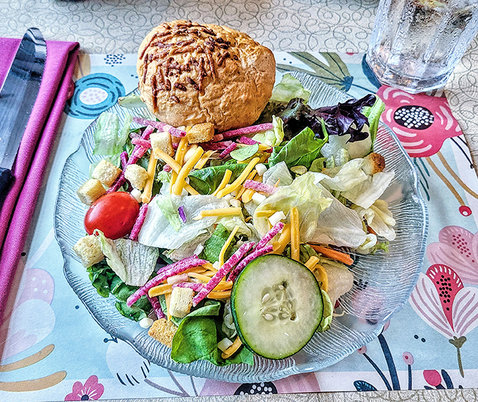 Not just a side act. The fresh dinner salad with its colorful vegetables and house-made roll proves even the supporting players deserve applause.