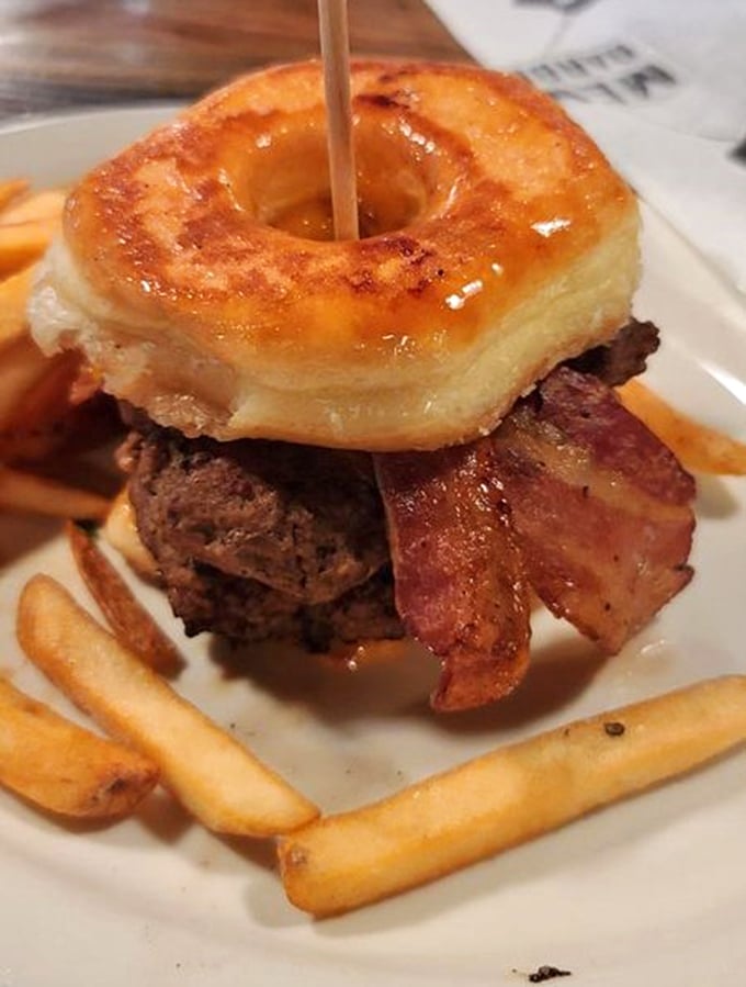 The donut burger – where sweet meets savory in an unholy alliance that somehow works so perfectly you'll question everything you thought you knew.