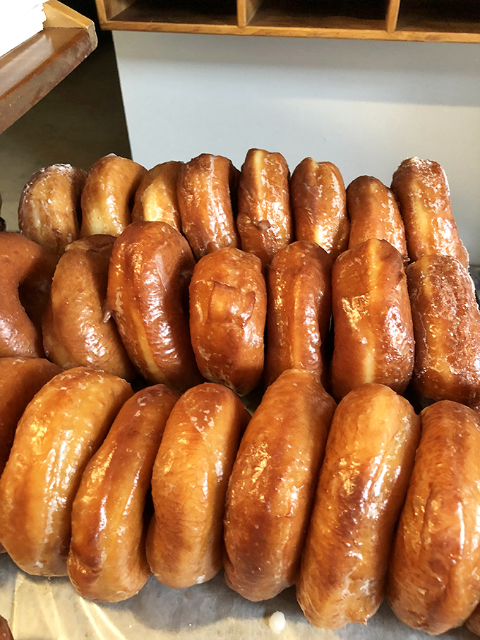 These glazed donuts have the kind of glow-up that Instagram filters try desperately to replicate. The real deal always shines brightest.