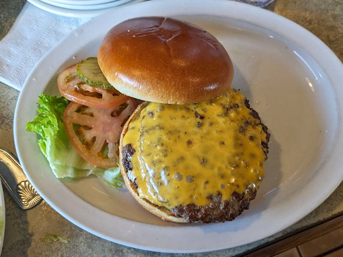 A cheeseburger that doesn't need gimmicks&mdash;just perfectly melted cheese, fresh toppings, and a bun that knows its supporting role in this meaty masterpiece.
