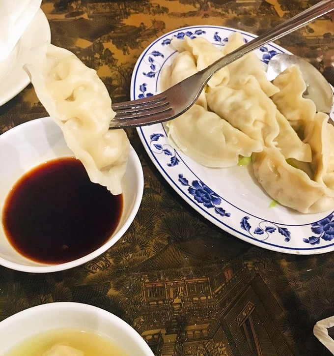 Dumplings so tender they practically surrender to your fork. The translucent wrappers reveal just enough of what's inside to make your mouth water in anticipation.