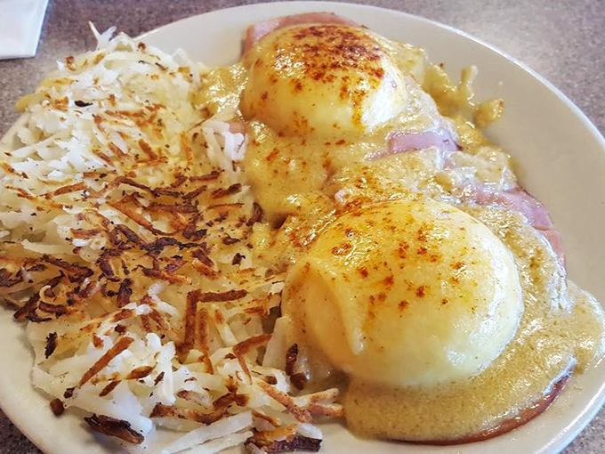 Eggs Benedict: where breakfast meets luxury. Those hash browns are playing the perfect supporting role in this morning masterpiece.