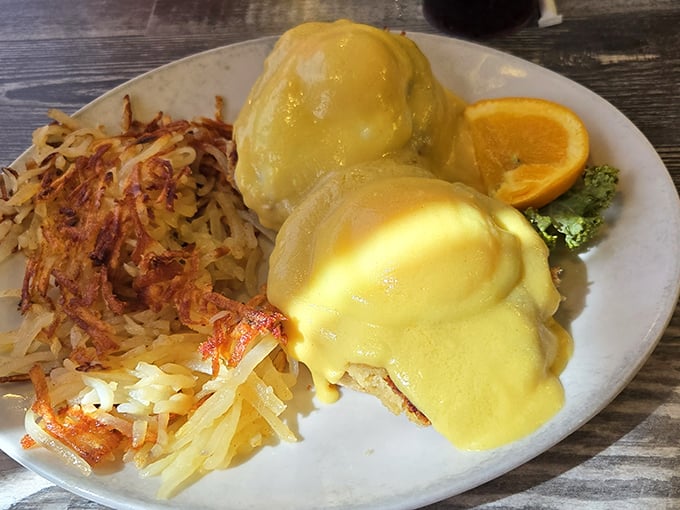 Eggs Benedict done right&mdash;golden hollandaise cascading down like a sunrise over the Ozarks. Those hash browns deserve their own fan club.