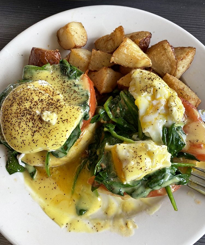 Eggs Benedict dressed up fancy, proving breakfast can wear a tuxedo when it wants.