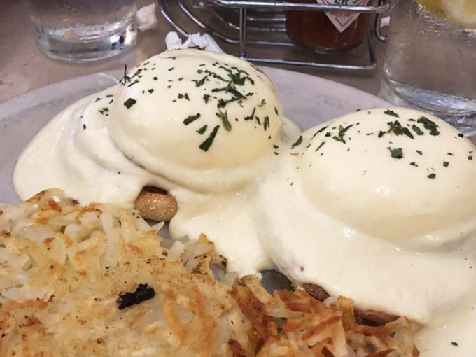 Their Eggs Benedict is architectural perfection &ndash; poached eggs balancing atop Canadian bacon like edible ivory towers.