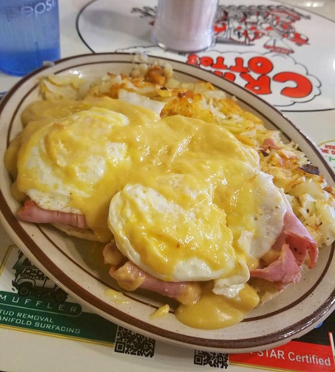 Eggs Benedict with a golden hollandaise waterfall cascading over ham and English muffins. Breakfast architecture that would make Frank Lloyd Wright weep with joy.