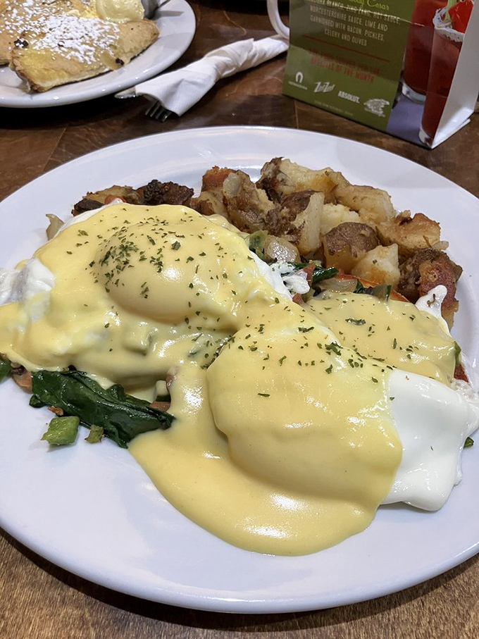 Eggs Benedict gets the Midwest treatment with hollandaise so yellow it could brighten even the grayest Nebraska morning. Those potatoes deserve their own fan club.