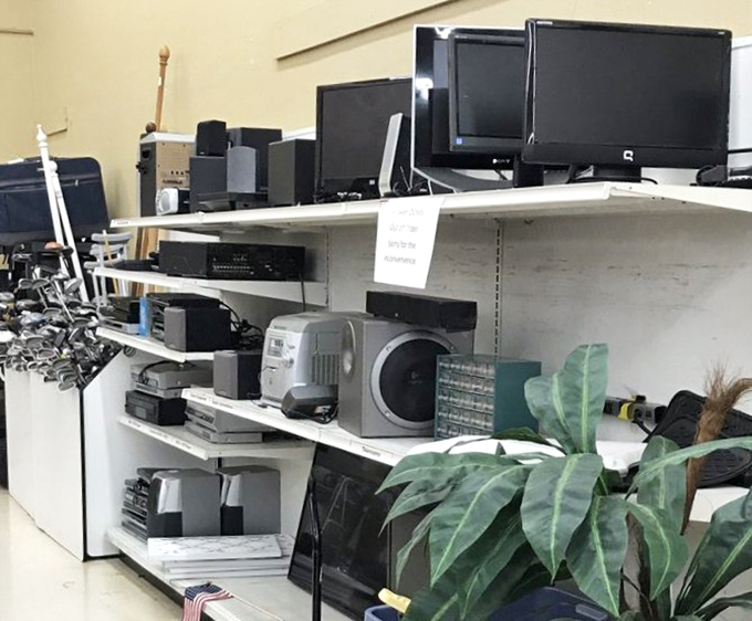 Technology time capsules line these shelves. Remember when a DVD player was the height of home entertainment luxury?