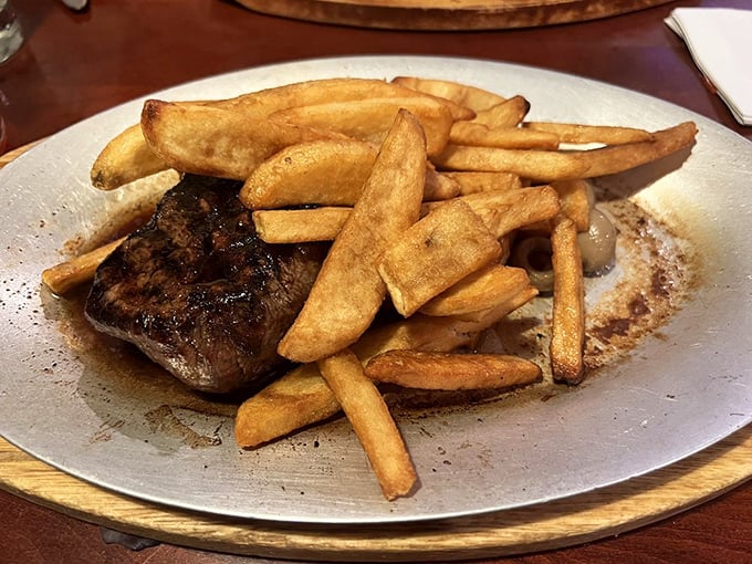 The filet mignon and steak fries create the kind of plate that makes neighboring diners pause mid-conversation to stare longingly.