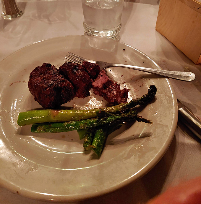 Tender filet mignon alongside vibrant asparagus spears &ndash; proof that sometimes the simplest combinations create the most profound dining experiences.