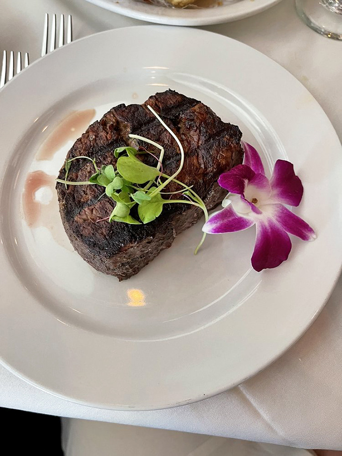 The star of our story: a filet mignon so perfectly seared and tender, it makes you question everything you thought you knew about seafood restaurants.