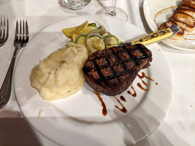 The filet mignon arrives like royalty&mdash;tender enough to cut with a whisper, accompanied by mashed potatoes so creamy they deserve their own fan club.