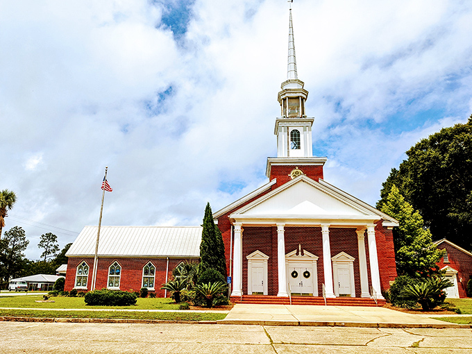 This isn't just a church; it's a postcard-perfect slice of Americana with its crisp white columns and soaring red-brick façade topped by a heavenly spire.