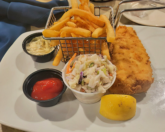 Golden-battered fish that shatters with each bite, served with fries so perfect they might make a Frenchman weep with joy.