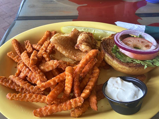 Golden-fried perfection meets fresh seafood. This fish sandwich with sweet potato fries delivers that satisfying crunch that makes your taste buds stand at attention.