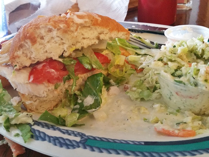 Fresh catch nestled in a bun with all the fixings &ndash; sometimes the simplest presentations deliver the most memorable flavors.