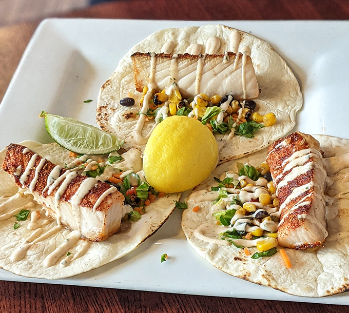 Fish tacos that bring a taste of coastal vacations to landlocked Ohio, complete with that perfect drizzle of sauce that makes you want to lick your fingers.