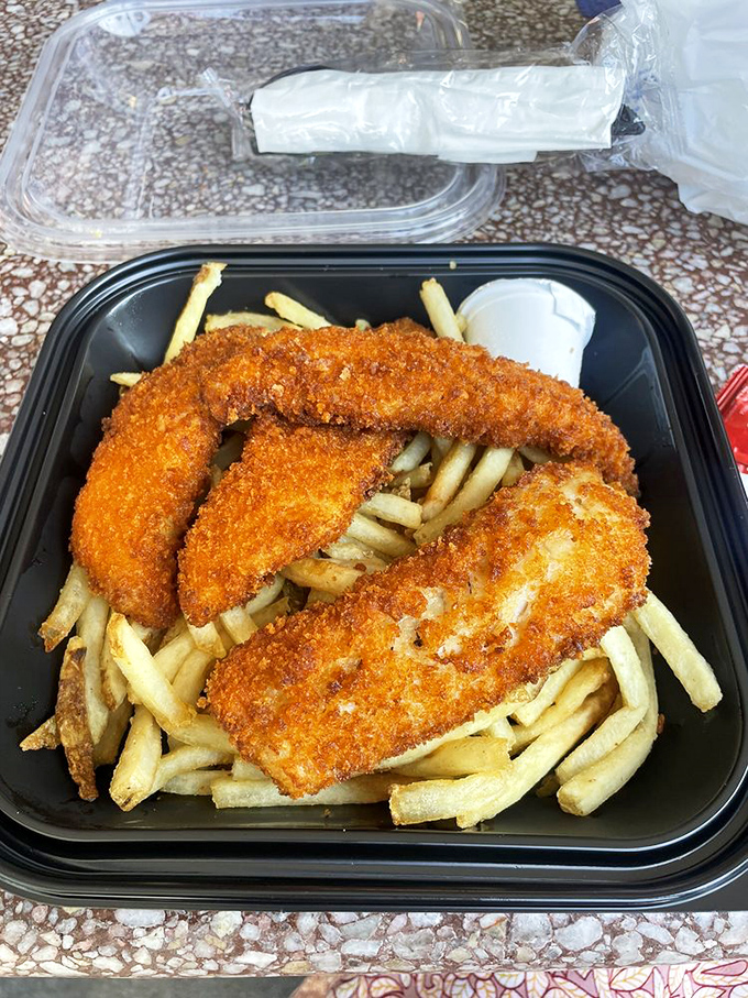 Golden-fried fish sitting atop a mountain of fries&mdash;this is comfort food that actually comforts.